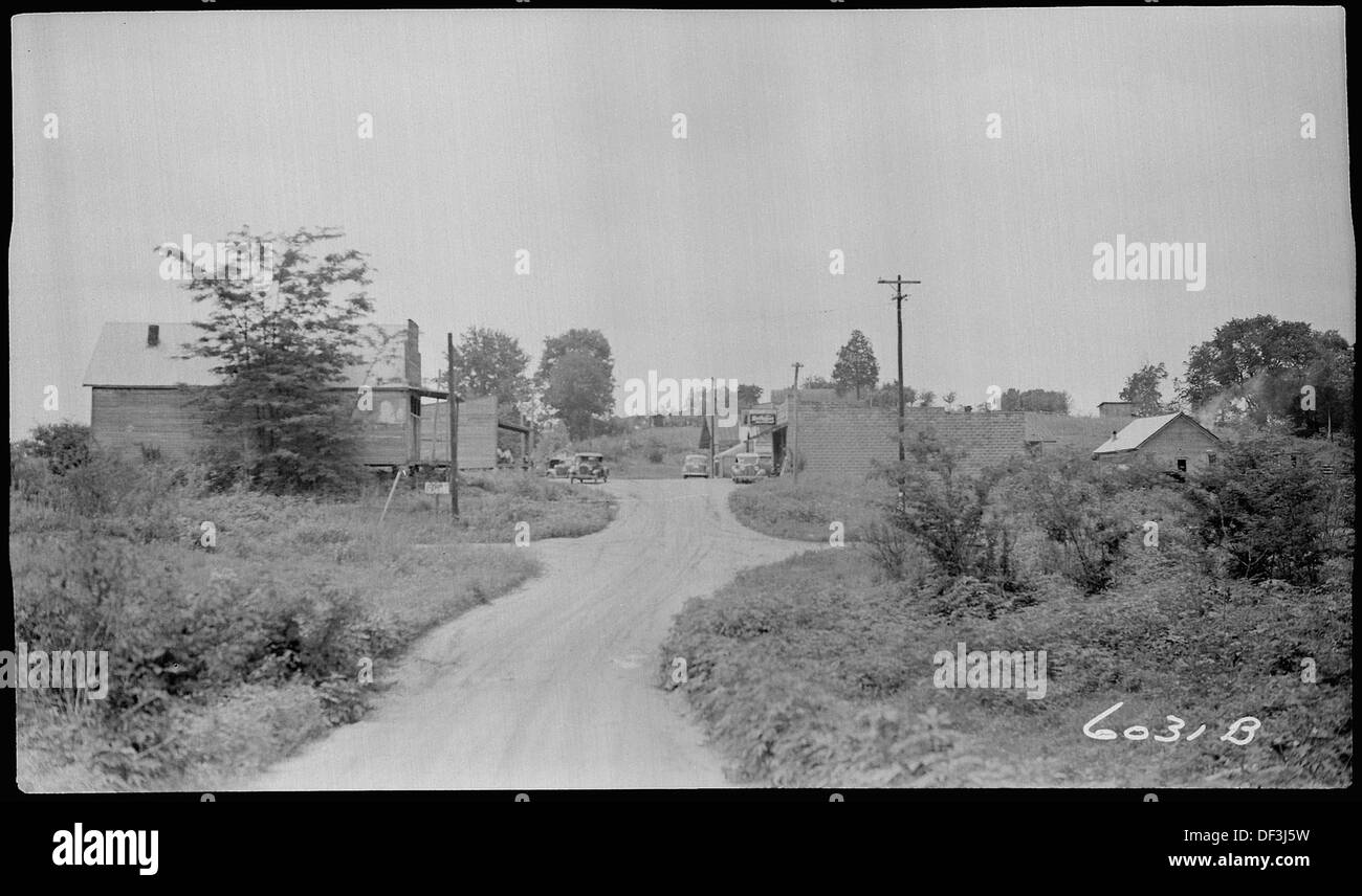 This historical photograph showcases a bustling business district ...