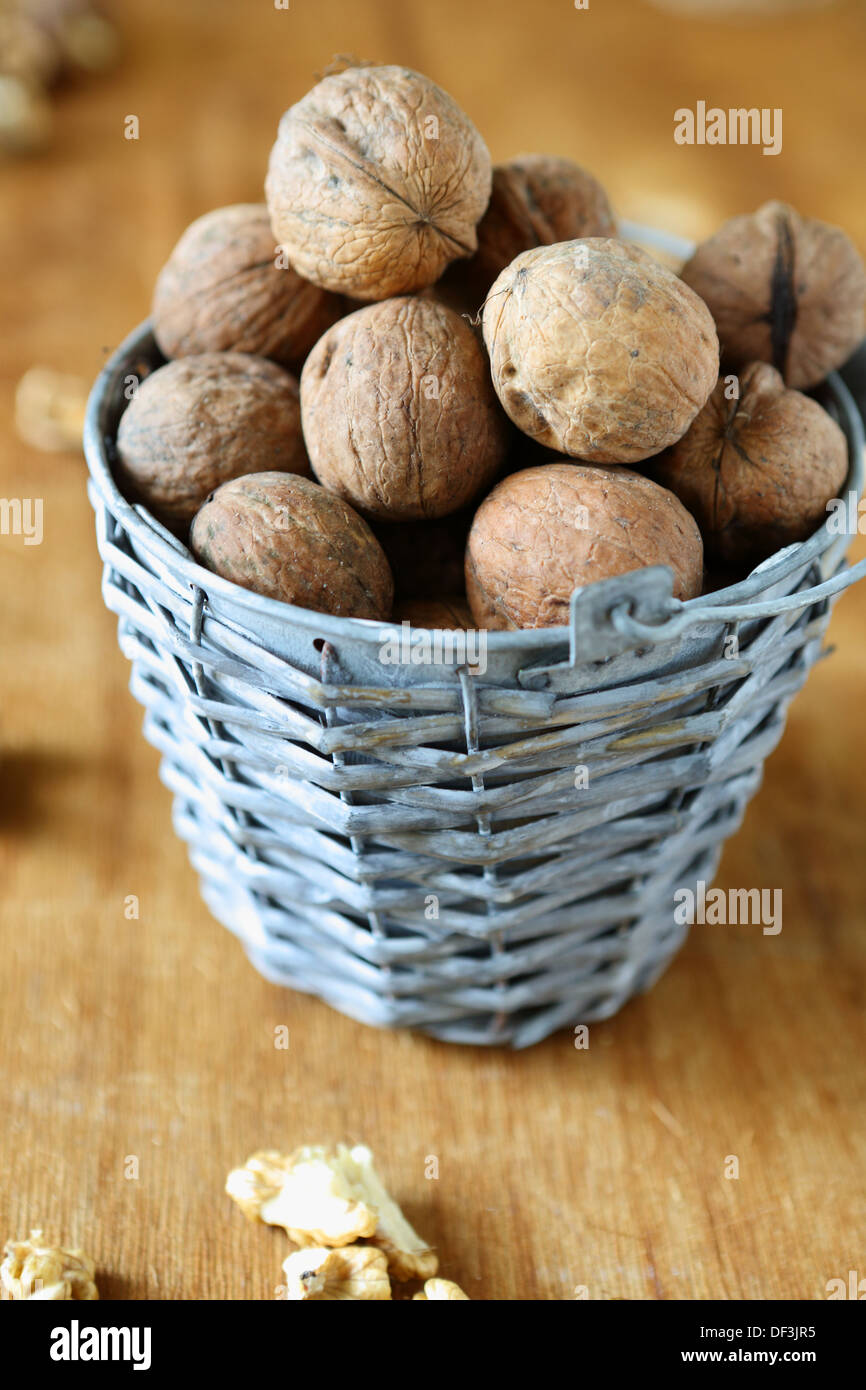 harvest walnuts in a wicker bucket , food Stock Photo - Alamy