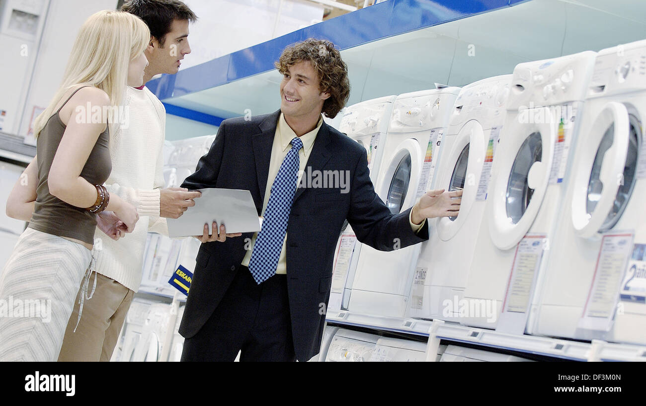 Couple shopping for washing machine hi-res stock photography and images ...