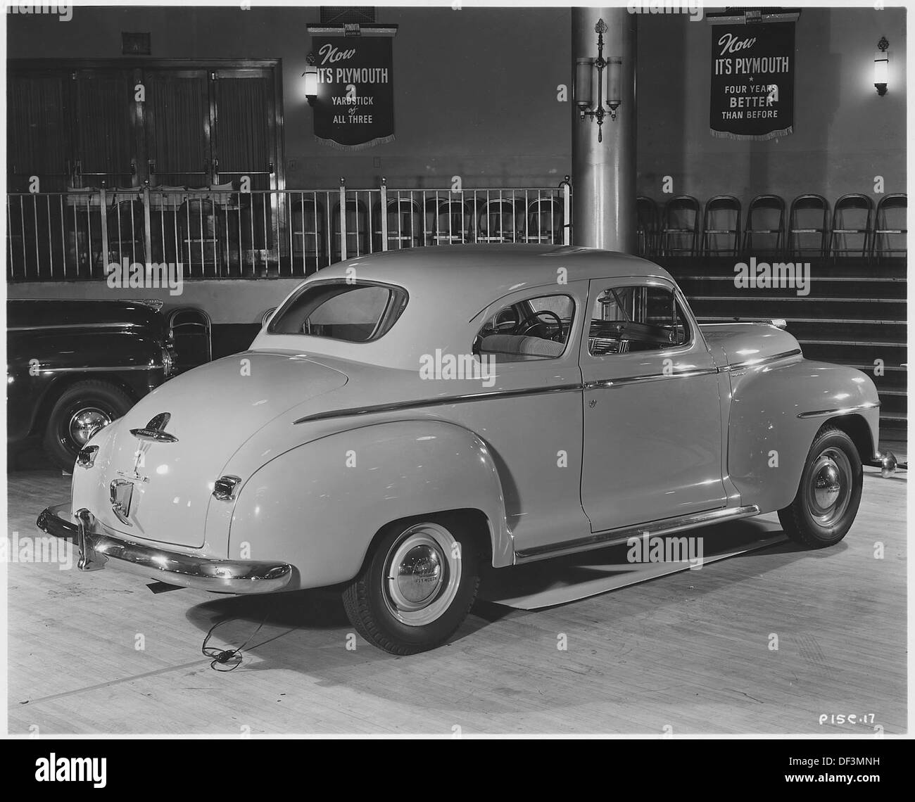 This historical photograph features automobiles from Chrysler, Dodge ...