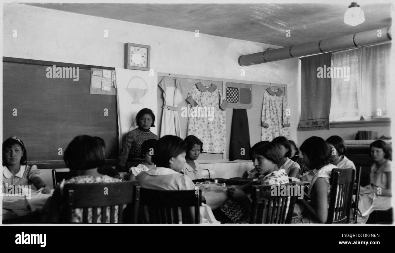 This image shows a classroom setting from the early 20th century ...