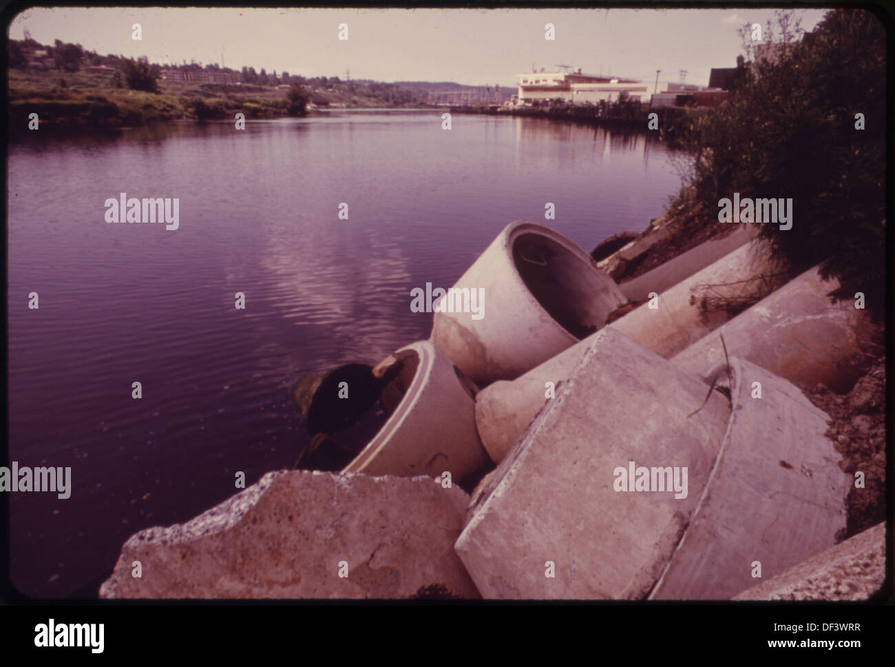 CULVERT PIPE AND CABLES DUMPED AS RIPRAP (A HAPHAZARD SUSTAINING WALL ...