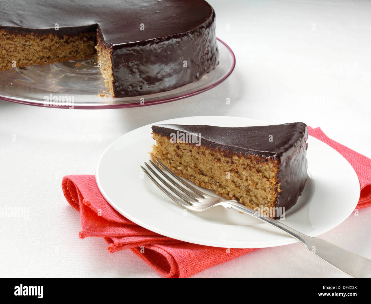 Toasted hazelnut cake with chocolate glaze Stock Photo - Alamy