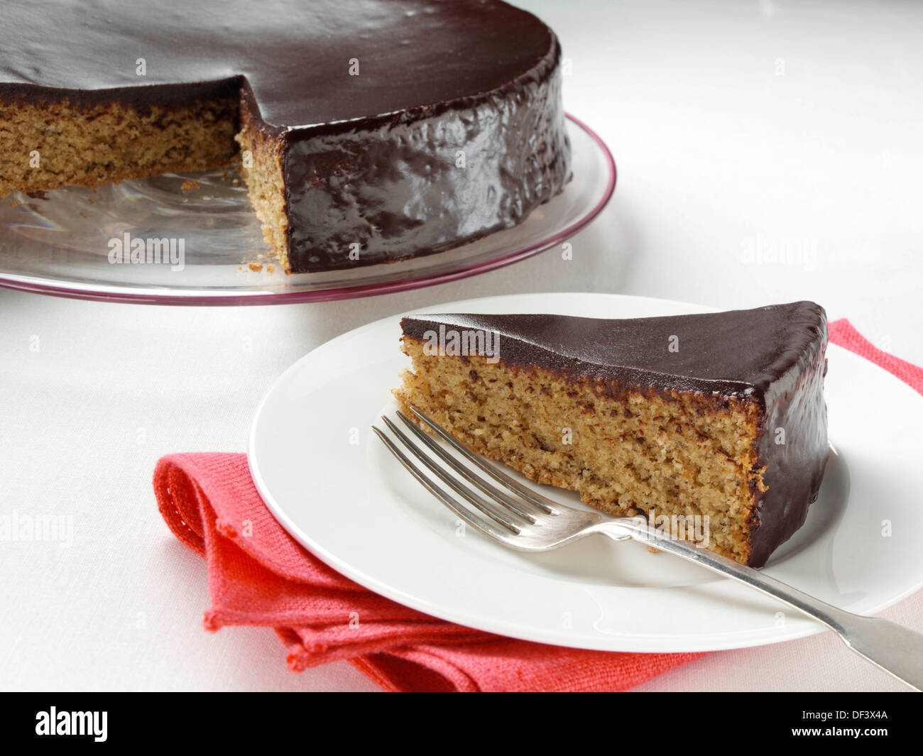 Toasted hazelnut cake with chocolate glaze Stock Photo - Alamy