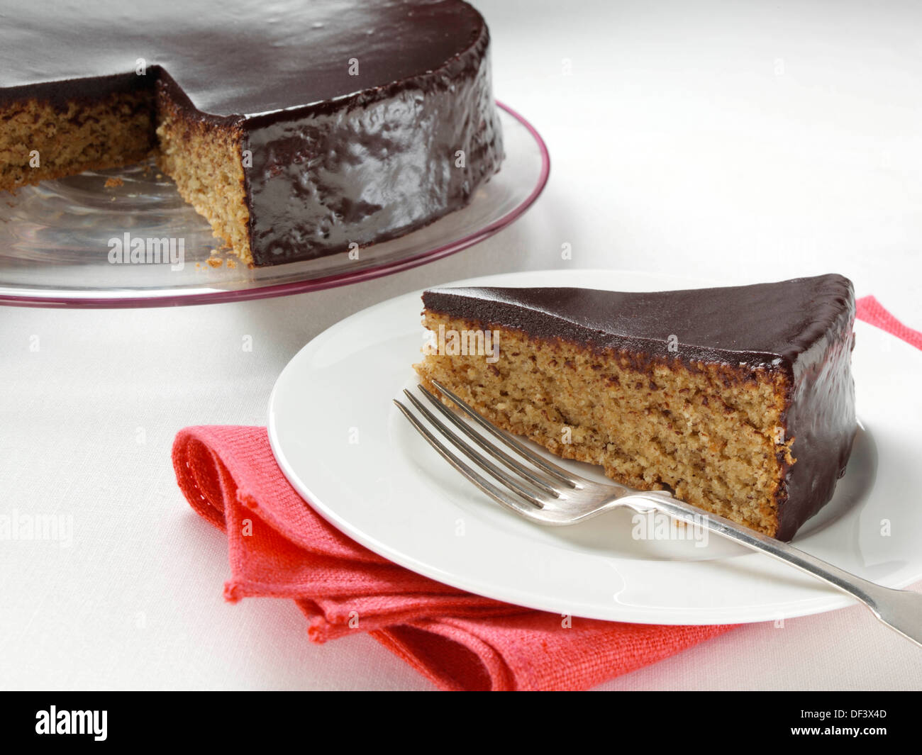 Toasted hazelnut cake with chocolate glaze Stock Photo - Alamy