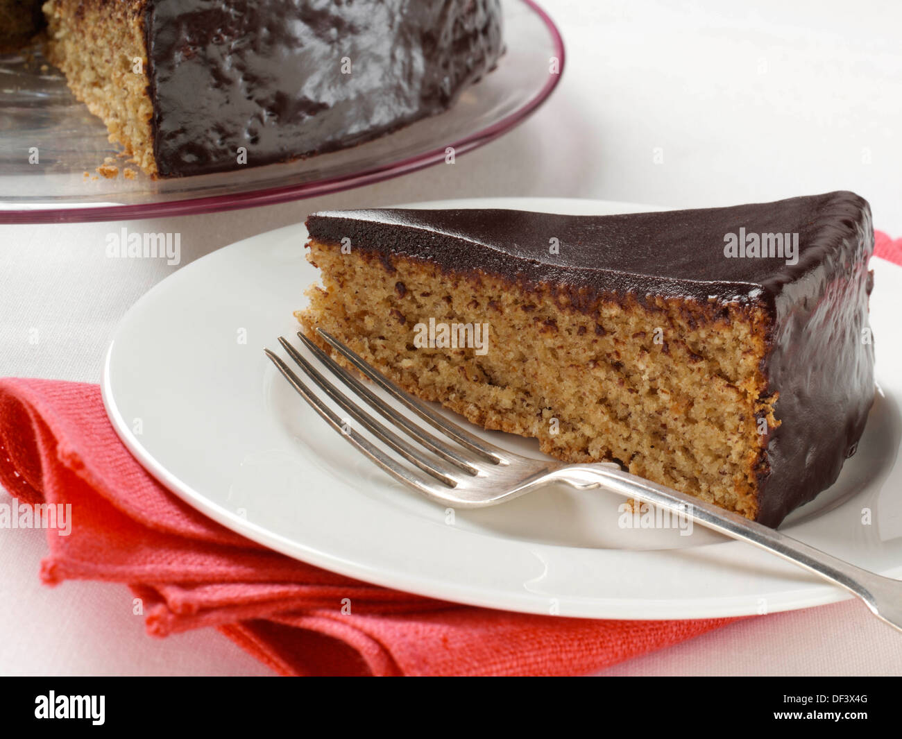 Toasted hazelnut cake with chocolate glaze Stock Photo - Alamy