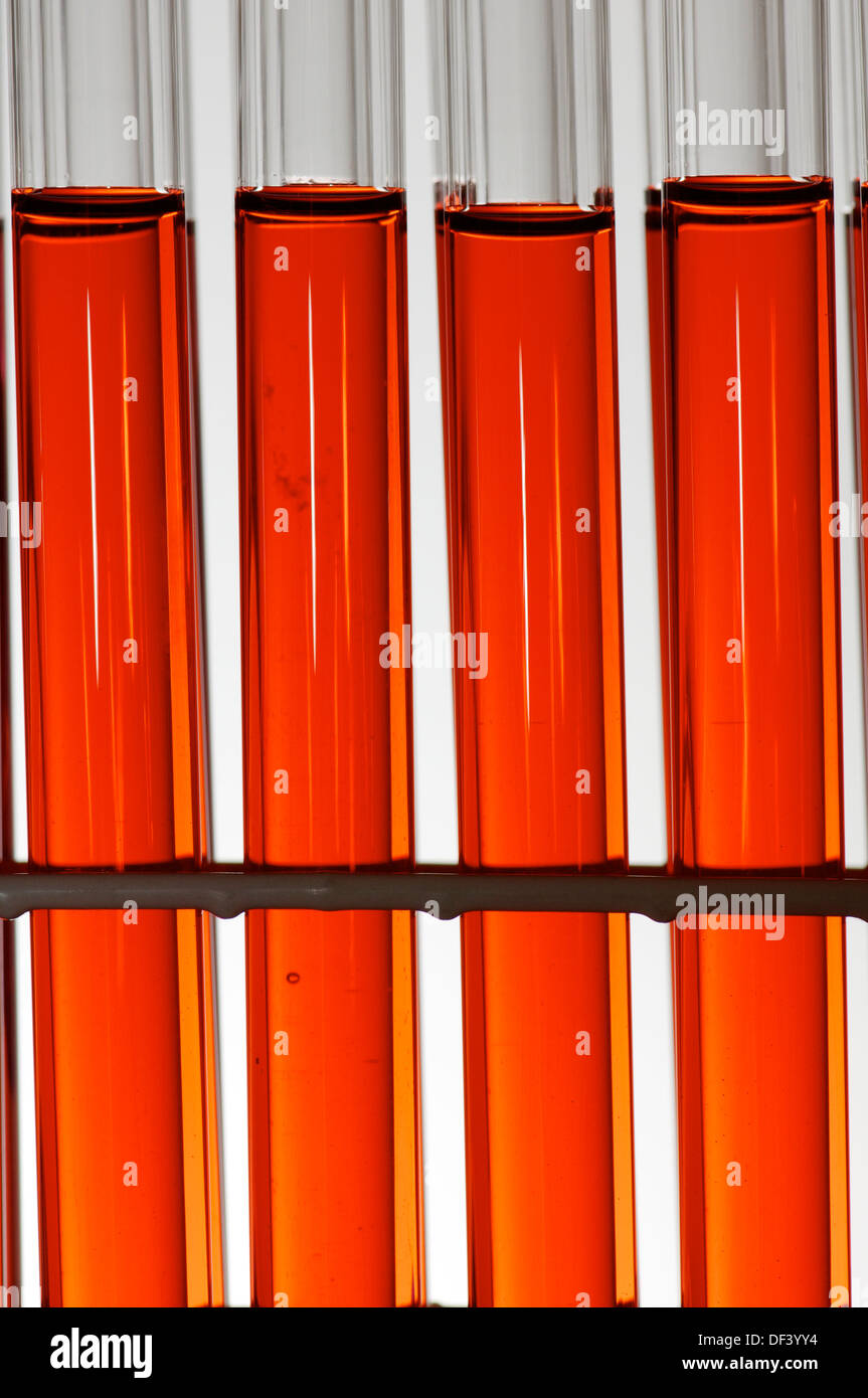 group of laboratory test tubes with red liquid inside Stock Photo - Alamy