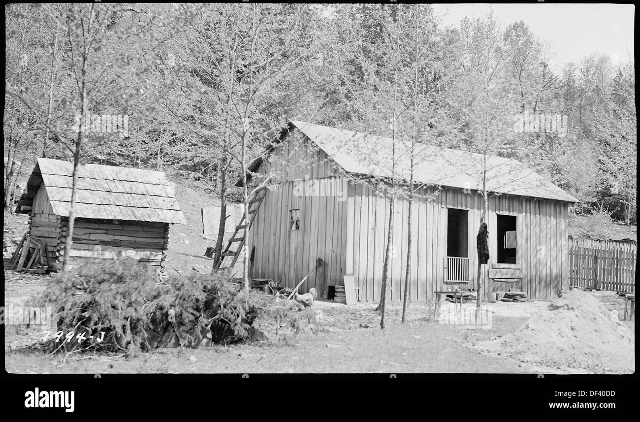 A historical photograph of Joe Dodson’s home. The image provides ...
