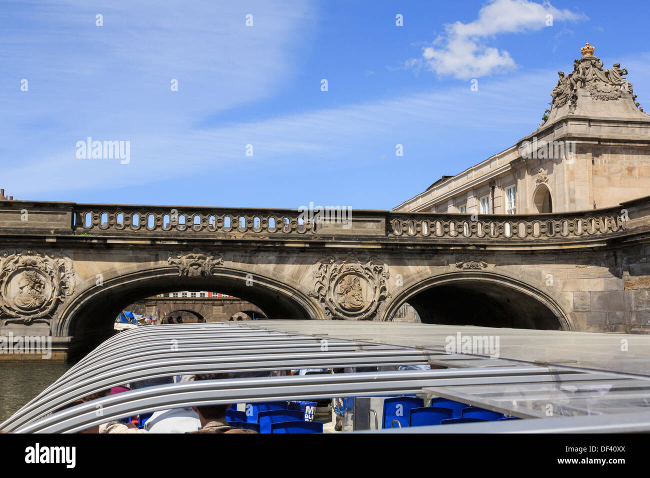 Tourists' sightseeing cruise boat approaching low Storm Broen Bridge on ...