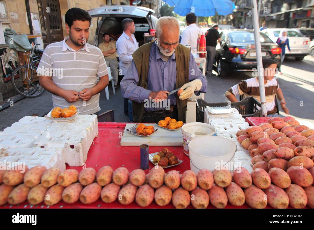 A man sells cactus pears in the street of the centre of Damascus, Syria ...