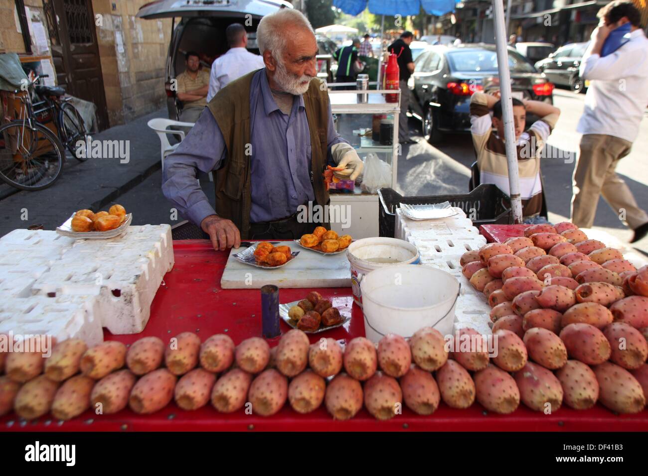 A man sells cactus pears in the street of the centre of Damascus, Syria ...