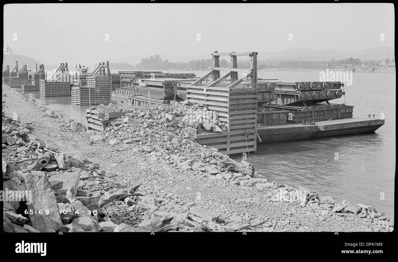 A Dravo Steel Company barge, equipped with spillway gates, is shown in ...