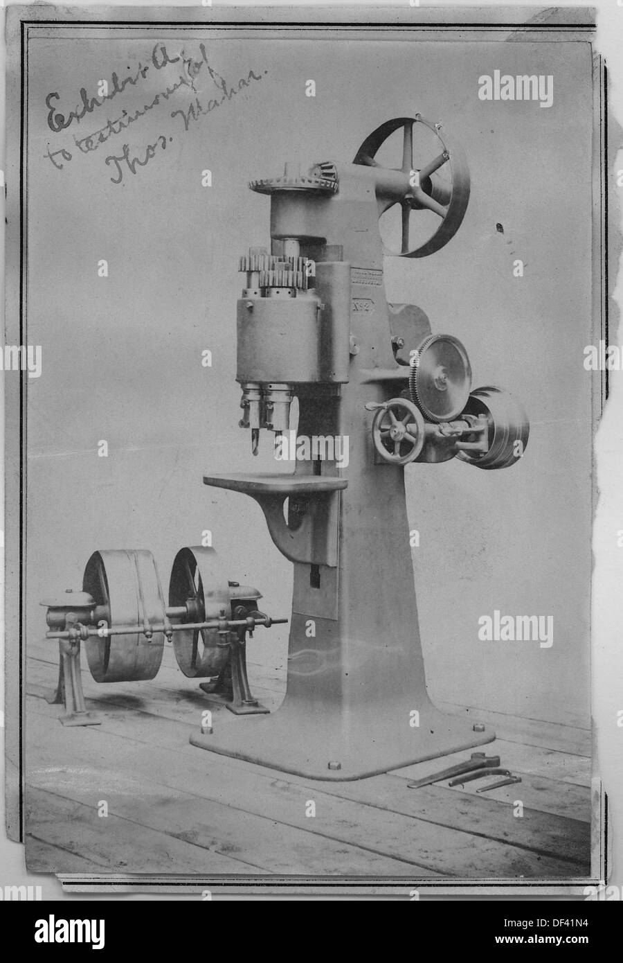 A photograph of a drill press in operation, taken in St. Louis. The ...