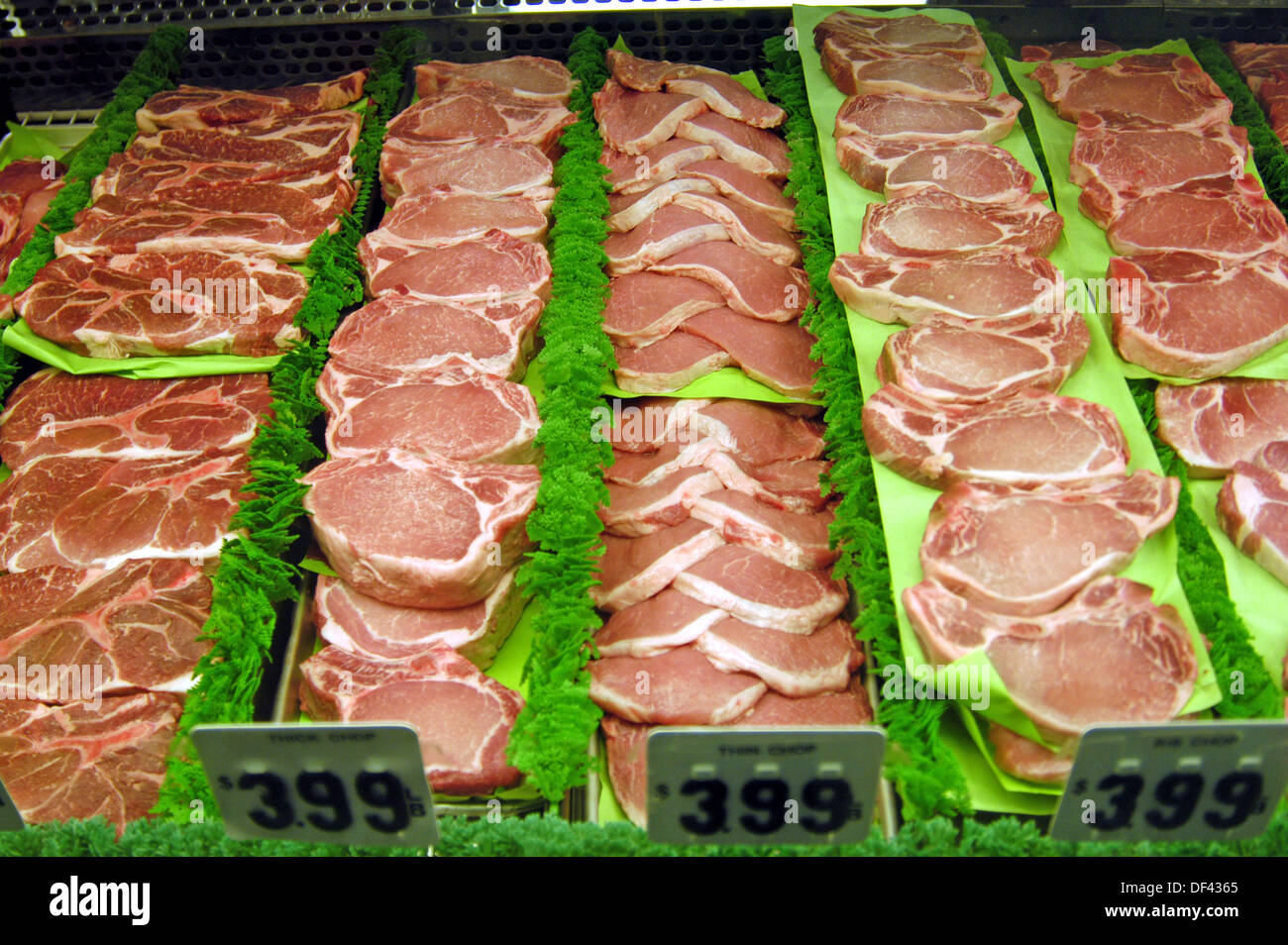Fresh meat and poultry on display in a store Stock Photo - Alamy
