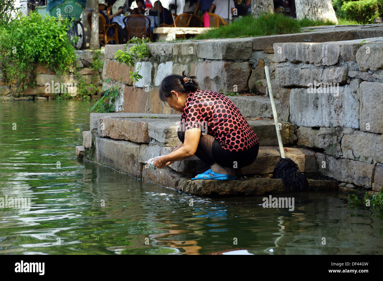 Chinese woman washing clothes in a canal at Tongli, China Stock Photo ...