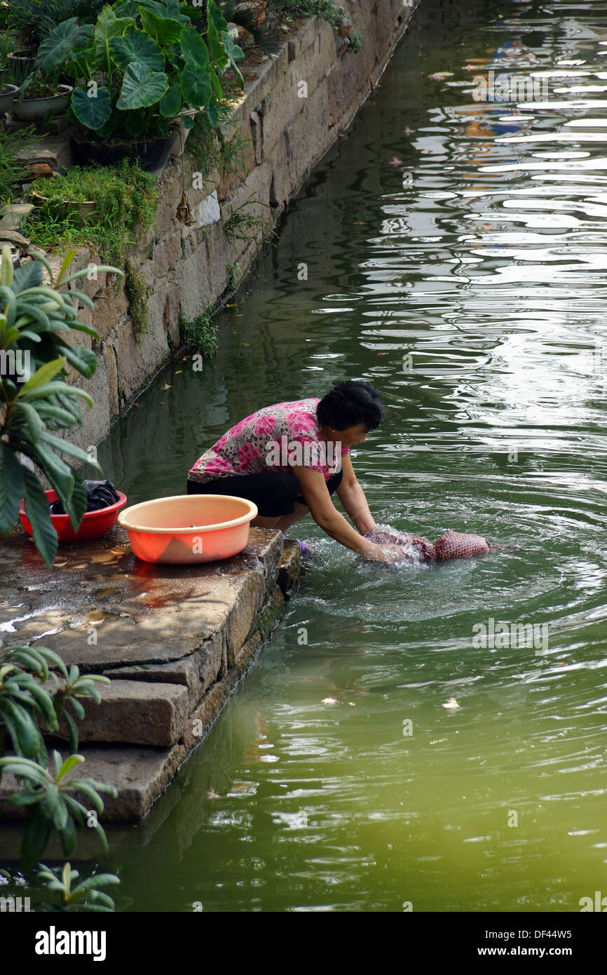 Chinese woman washing clothes in a canal at Tongli, China Stock Photo ...