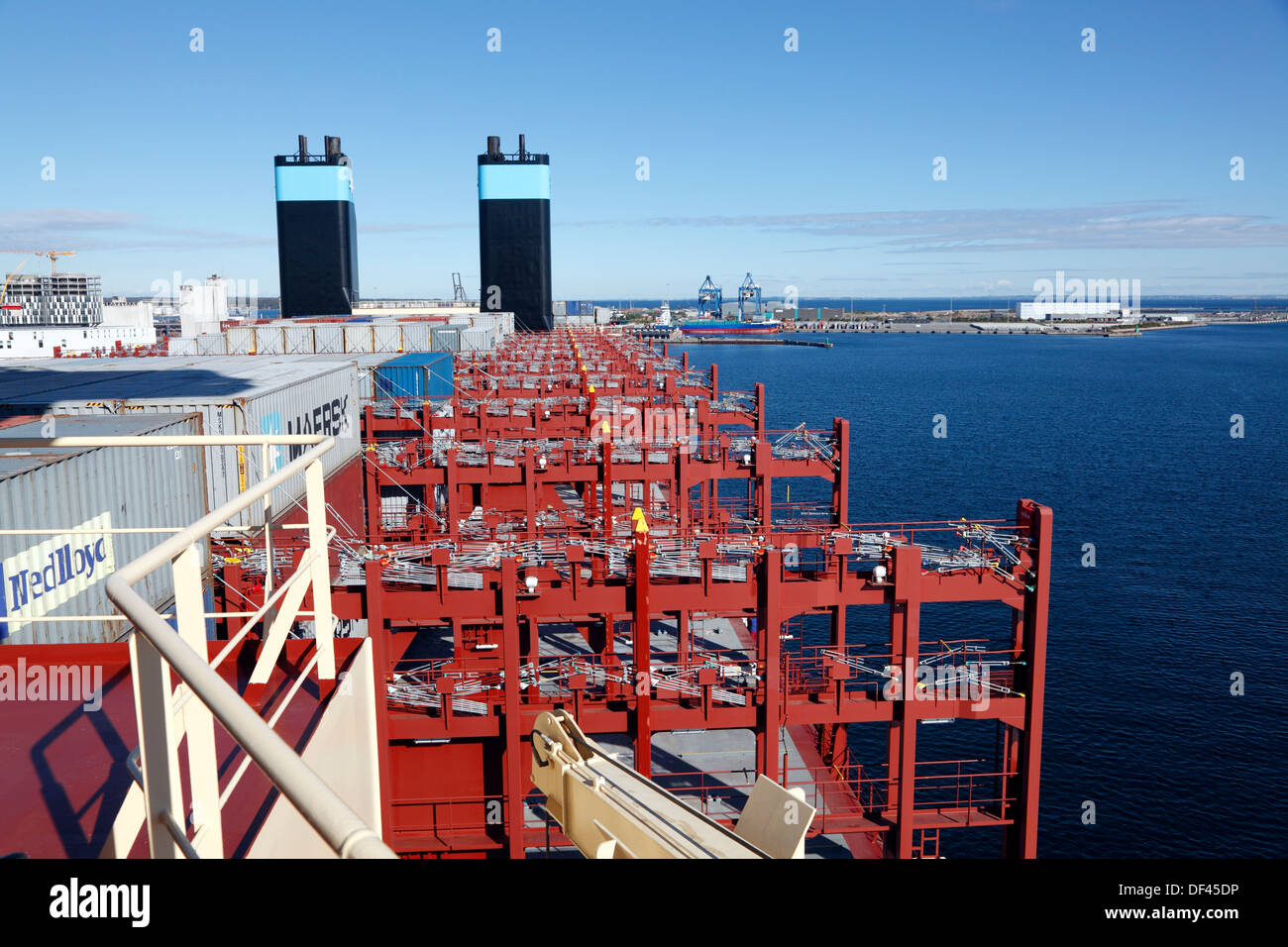 View of northern port of Copenhagen behind rails, funnels, containers ...