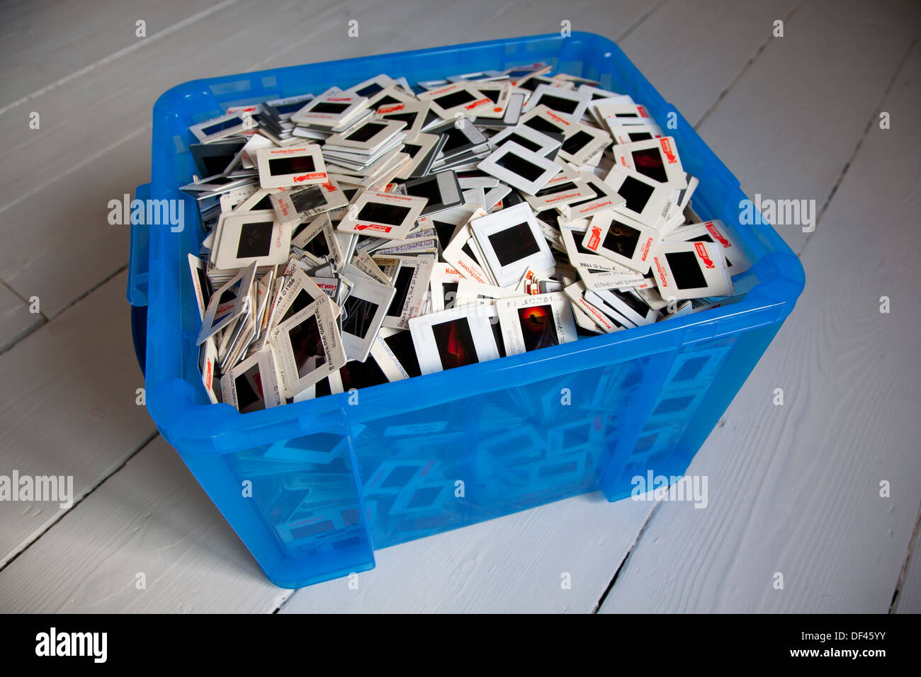 plastic storage box full of 35mm colour color transparencies on white ...