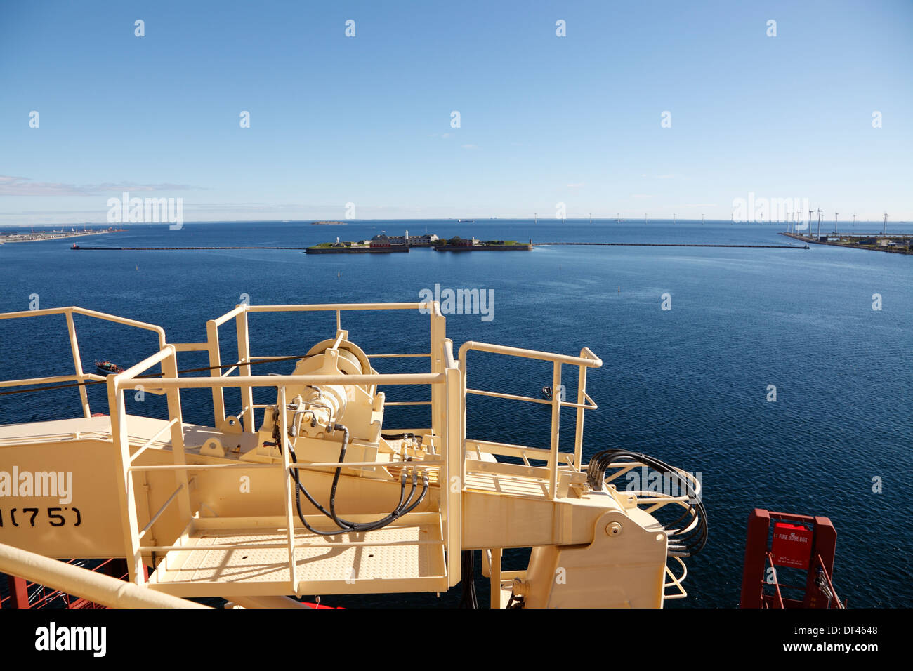 The Trekroner sea fort in the distance over yellow steel structures on ...