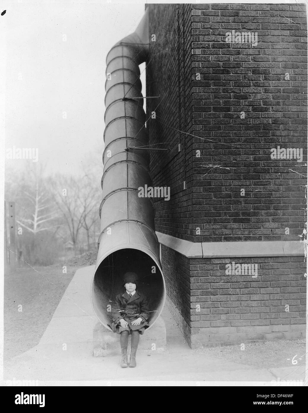 A fire escape tube, possibly from an old building, captured in a ...