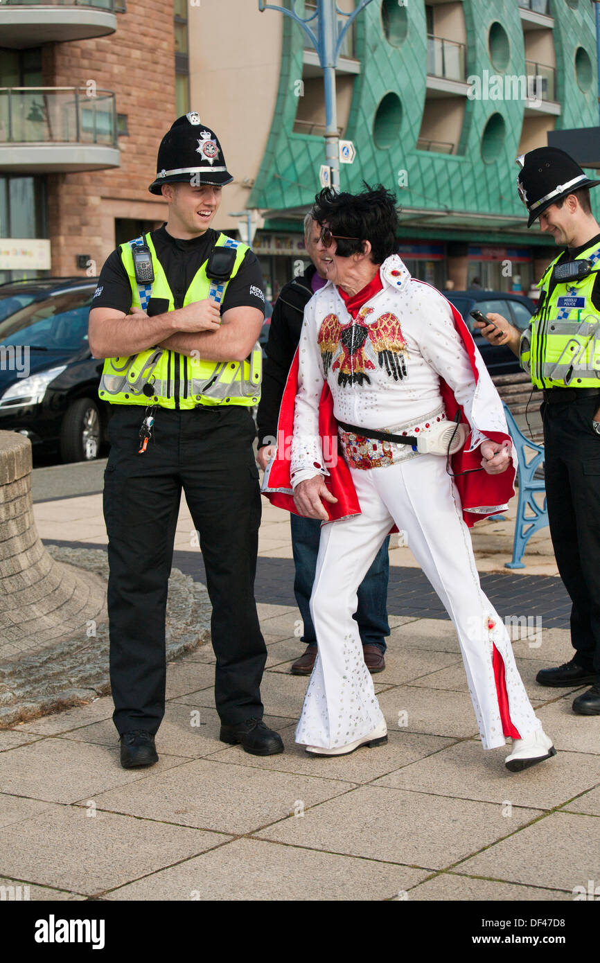 Bridgend, UK . 27th Sep, 2013. Elvis impersonator with Policemen at ...
