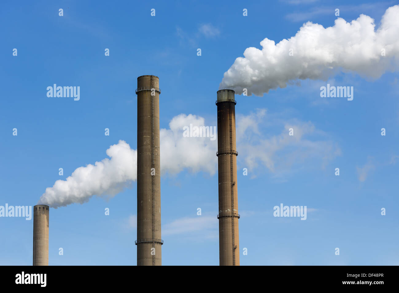Industrial smoke stacks of a power plant Stock Photo - Alamy
