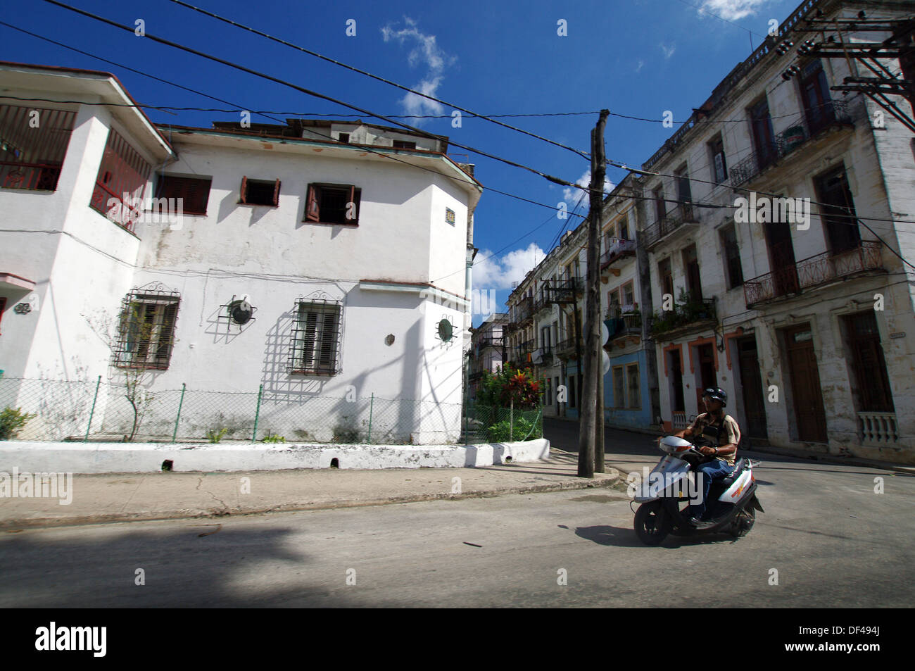 Young Cuban whizzing through the Vedado neighborhood of Havana, Cuba ...