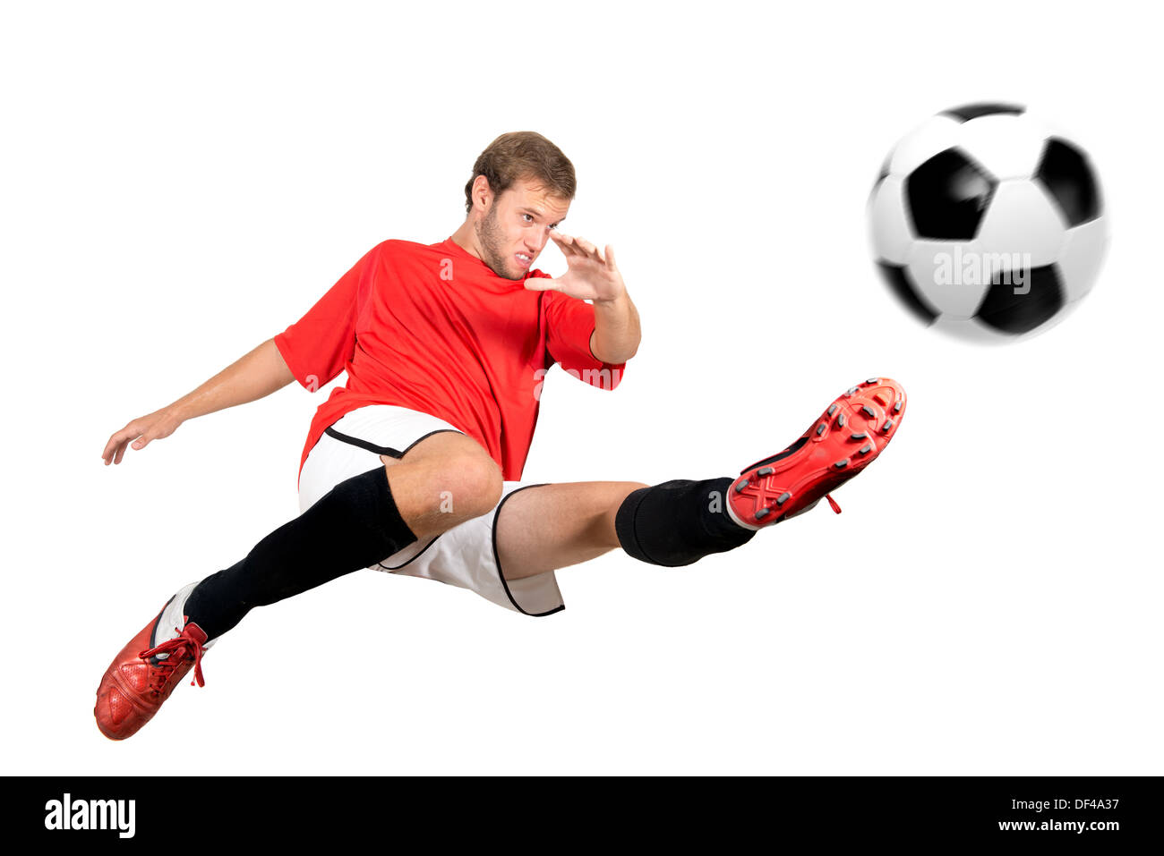 Football player kicking a ball isolated in white Stock Photo - Alamy
