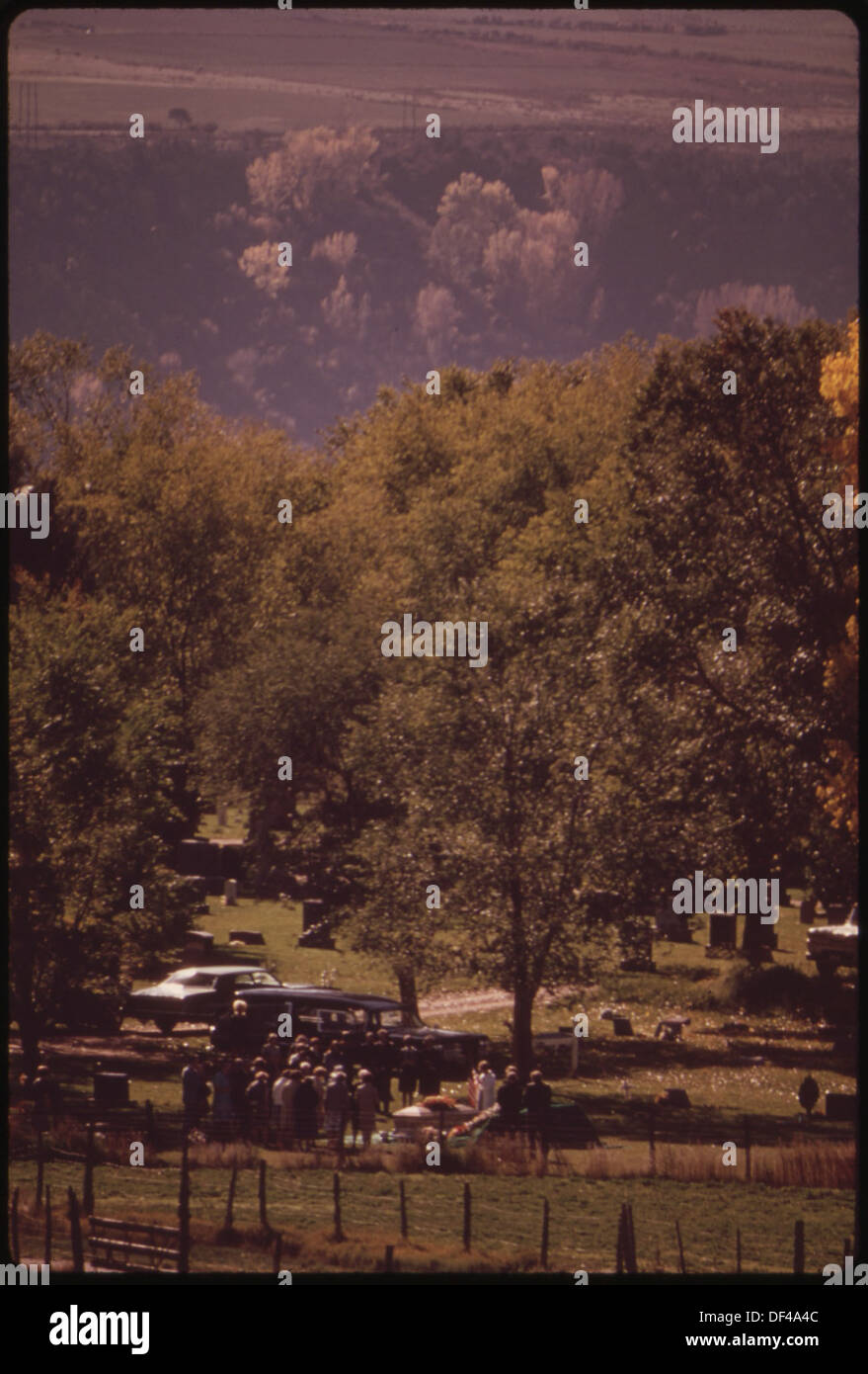 A somber scene of a funeral taking place in Rifle, Colorado, captured ...