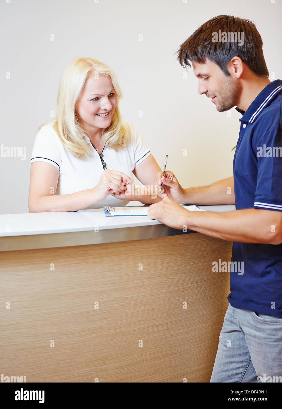 Doctor receptionist patient hi-res stock photography and images - Alamy