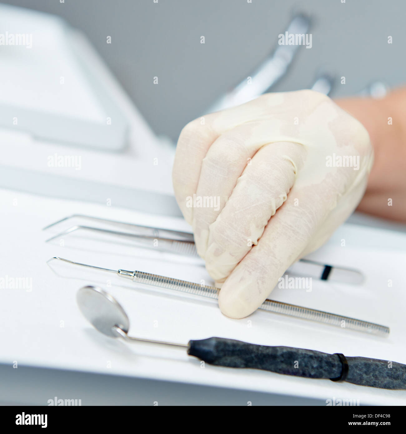 Hand of dentist reaching for probe for dental examination Stock Photo ...
