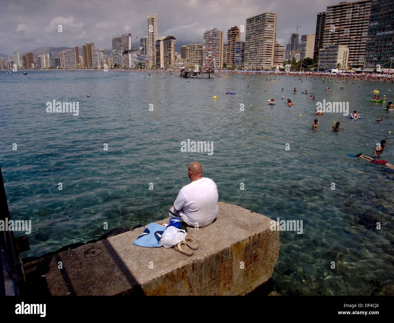 Overweight man sunbathing by the sea hi-res stock photography and ...