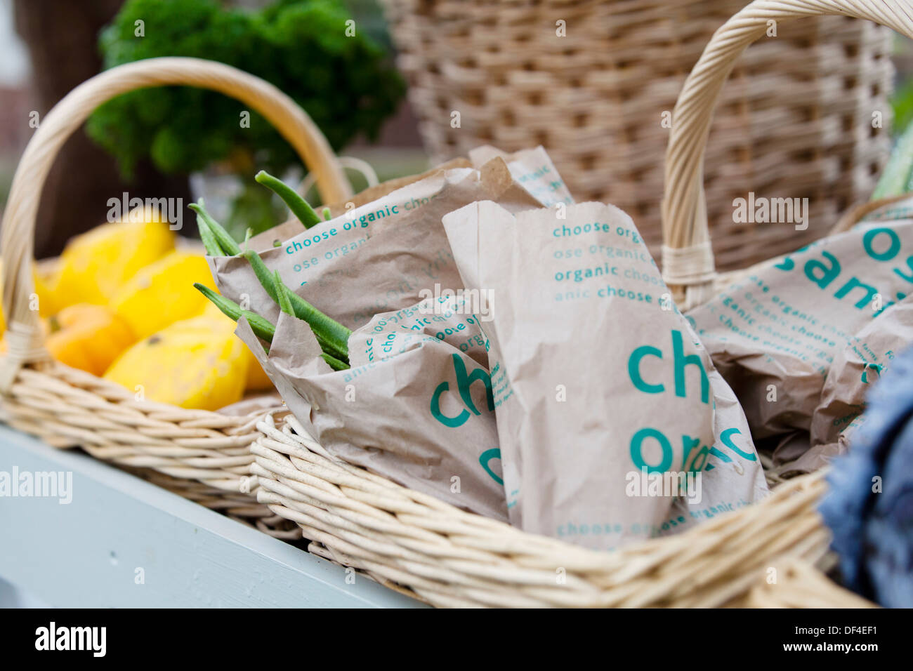 A bag of fresh runner beans for sale on an organic fruit and vegetable ...