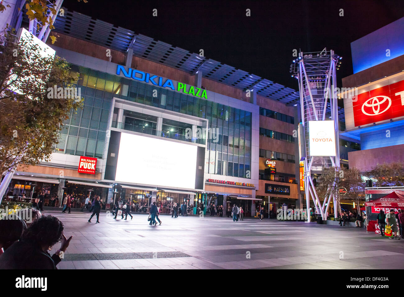 Nokia Plaza in Los Angeles at night with restaurants and Staples center ...