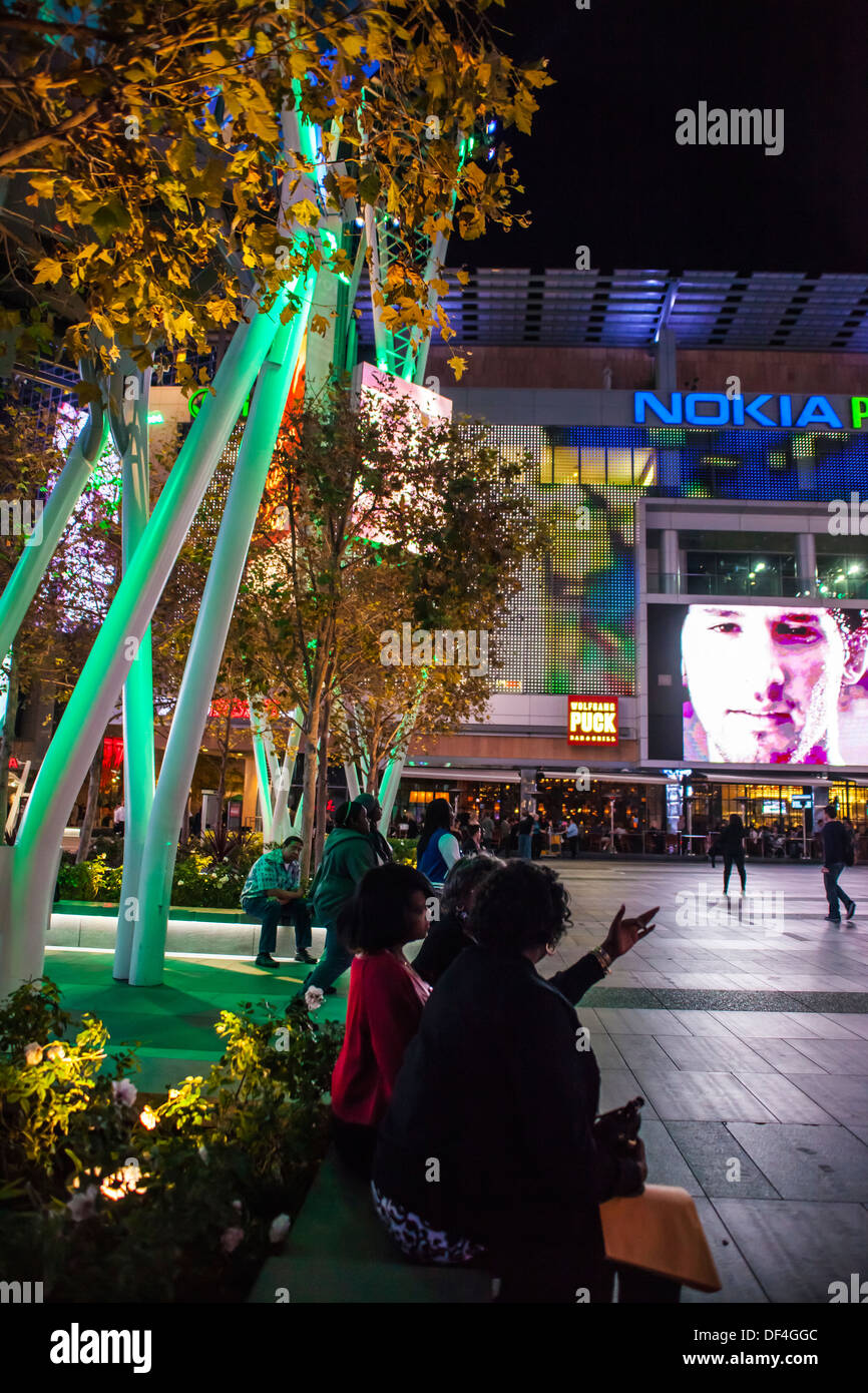 Nokia Plaza in Los Angeles at night with restaurants and Staples center ...