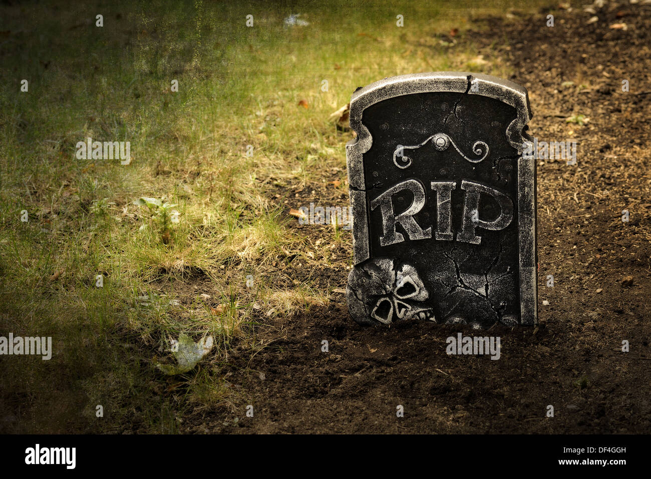 Grunge grave with tombstone Stock Photo - Alamy