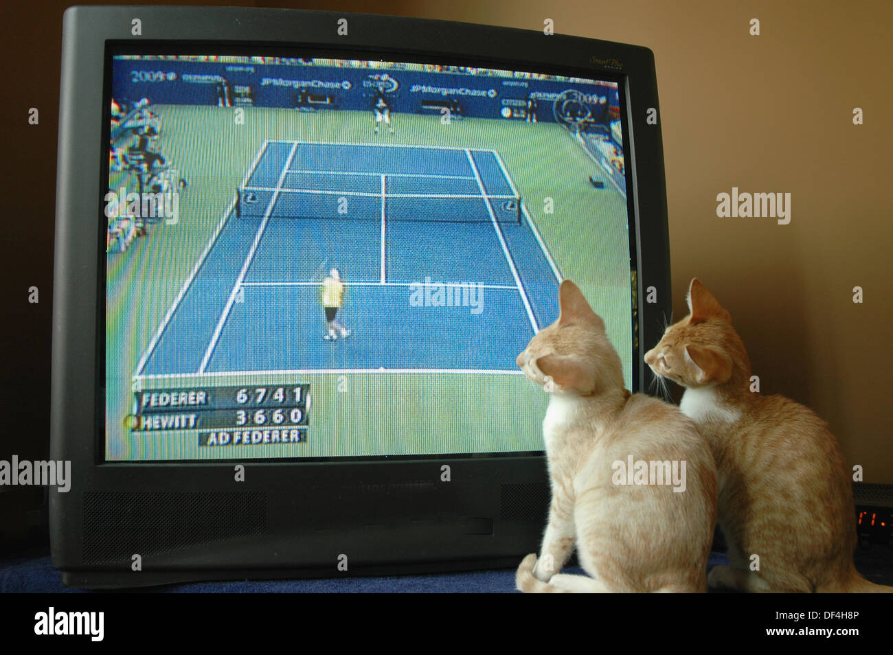 Watching tennis on tv hi-res stock photography and images - Alamy