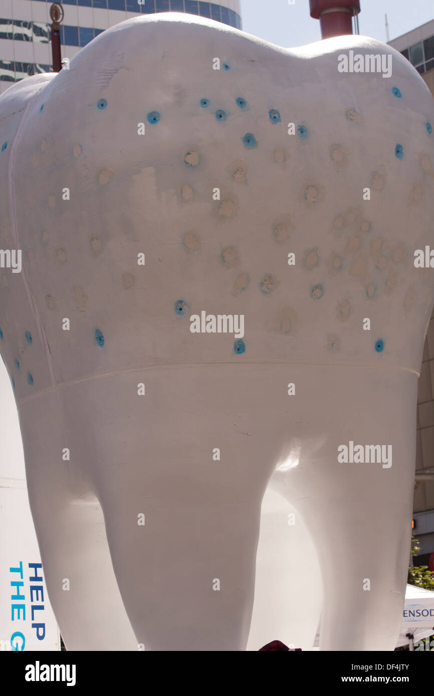 Big oversized tooth on display at Dundas Square in Toronto Stock Photo ...