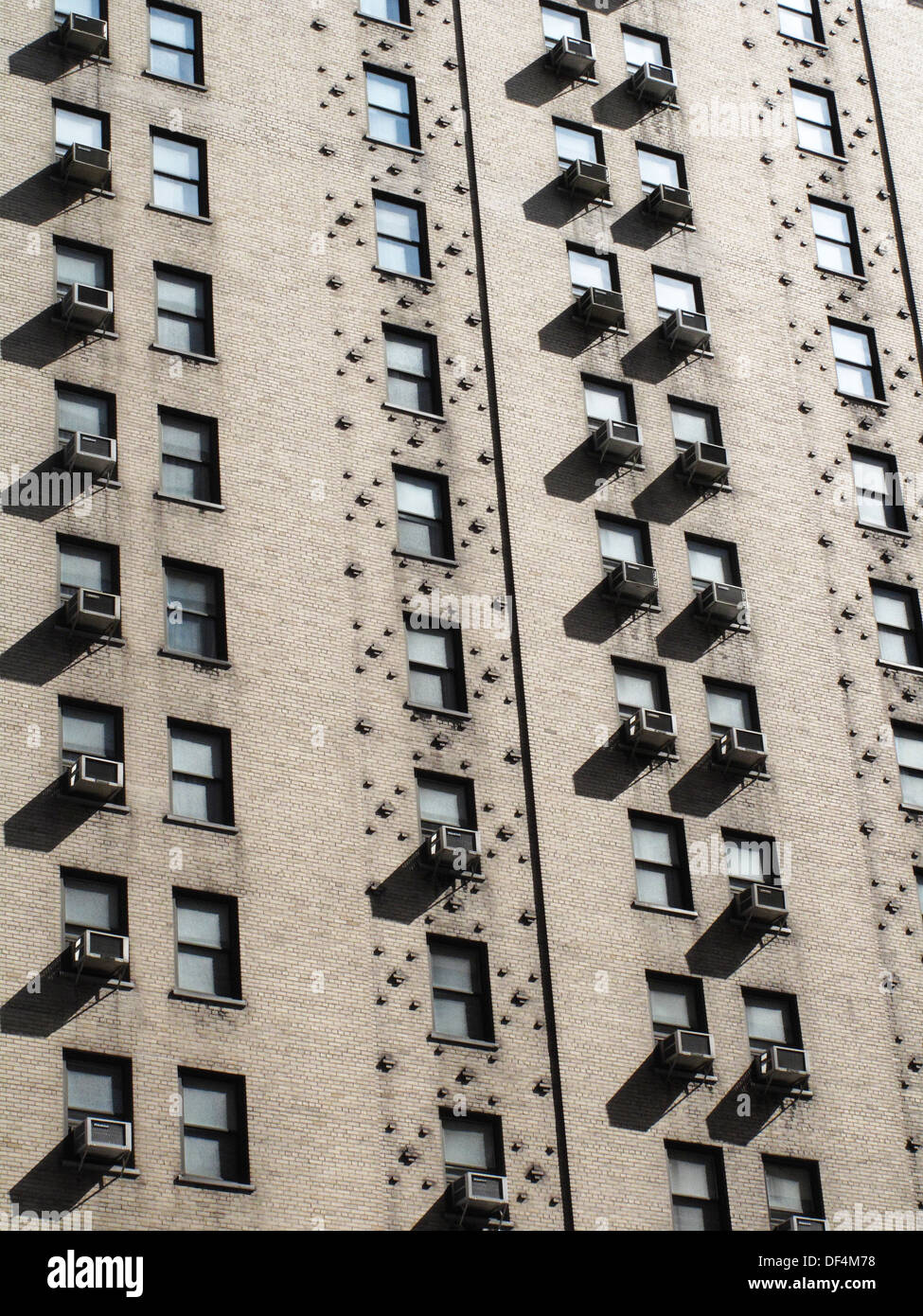 Tall Apartment Building Windows and Air Conditioners Stock Photo - Alamy