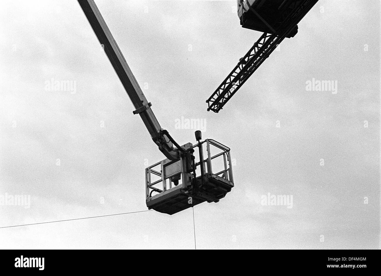 Bucket Lift and Crane Against Sky Stock Photo - Alamy