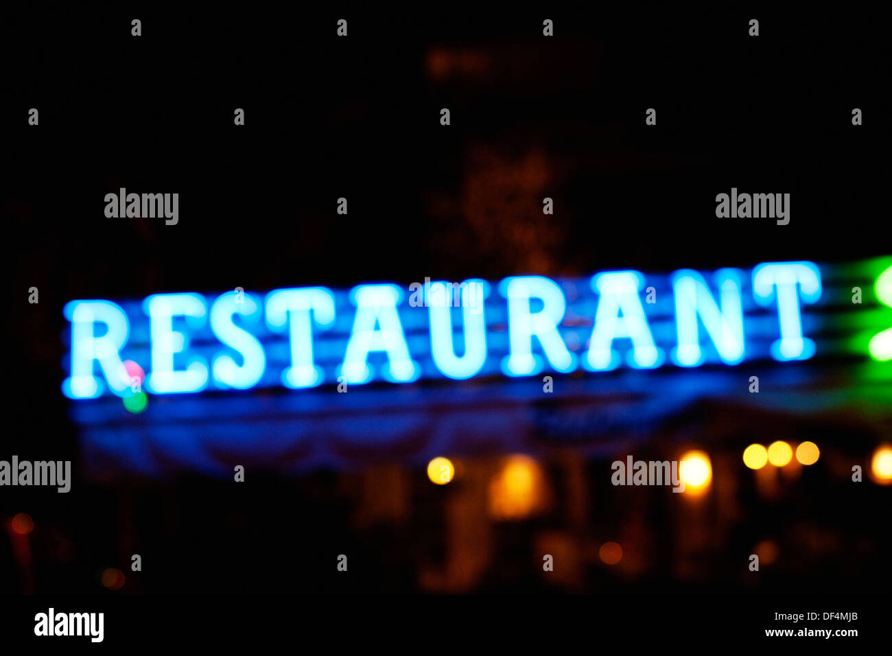 Illuminated Blue Restaurant Sign Stock Photo - Alamy