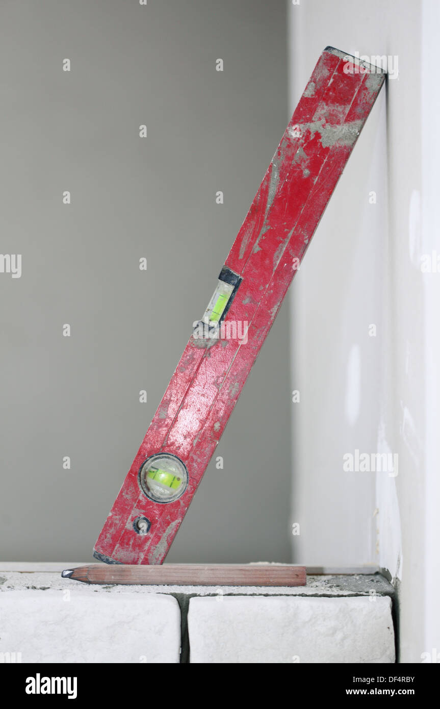 Red balance spirit building level in construction site Stock Photo - Alamy