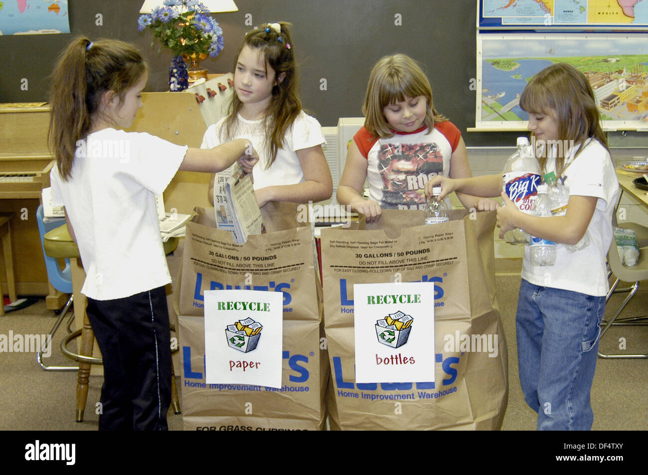 3rd graders recycle bottles and paper Stock Photo - Alamy