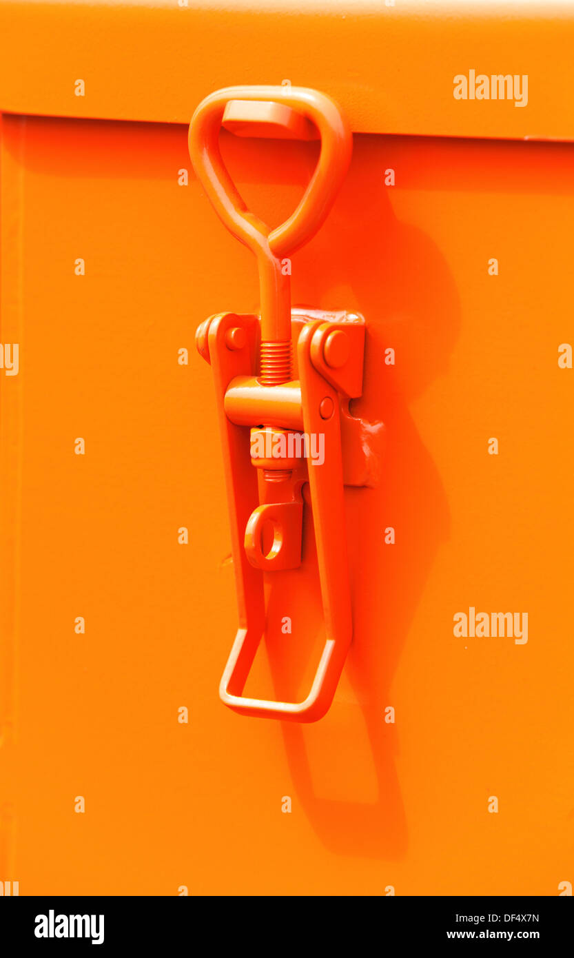 Lock in orange metal industrial big crate box Stock Photo - Alamy