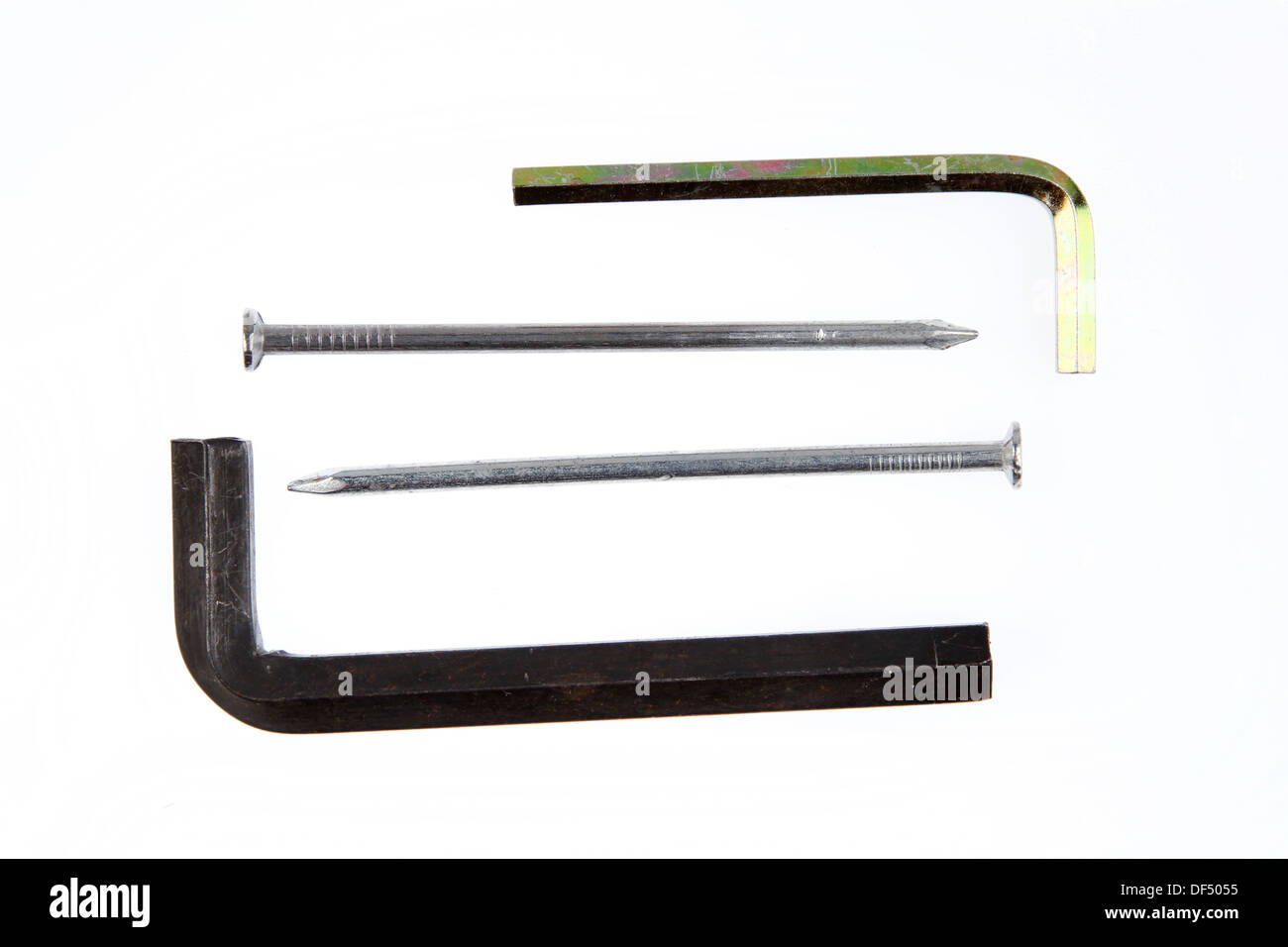 Hex keys and nails isolated on plain background Stock Photo - Alamy