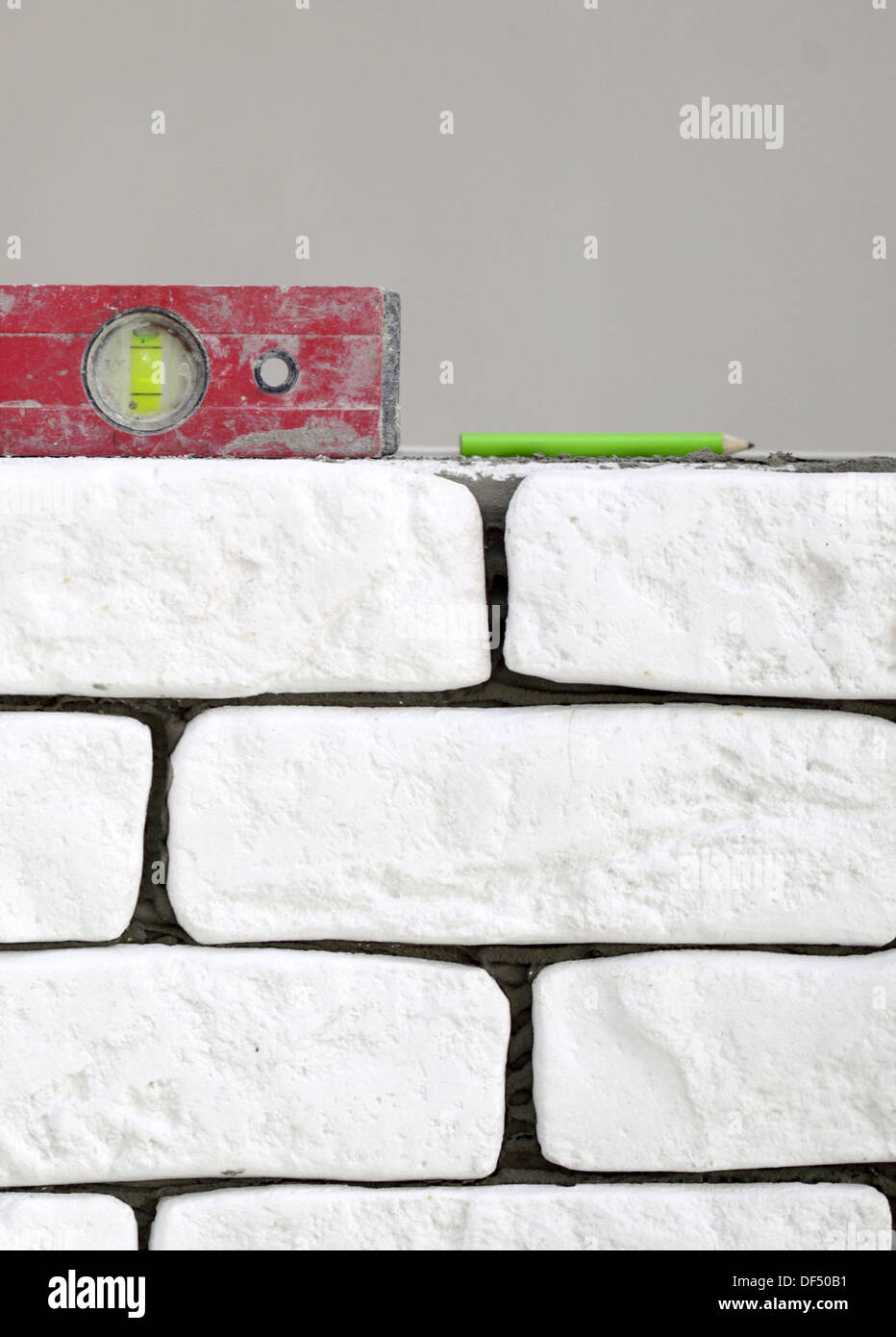 Red balance spirit building level in construction site. Check the level ...