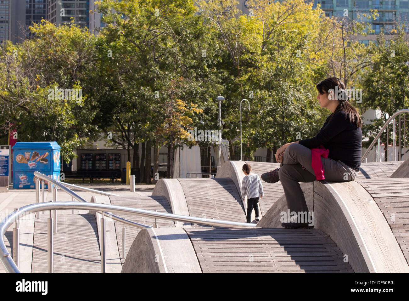 Woman and child on wavy walkway at Harbourfront in Toronto Stock Photo ...