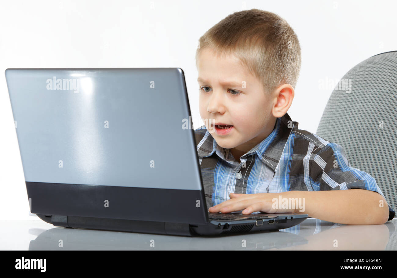 Computer addiction child boy with laptop notebook white background ...