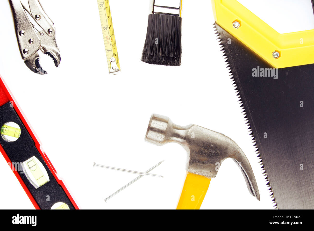 Assorted work tools on plain background Stock Photo - Alamy