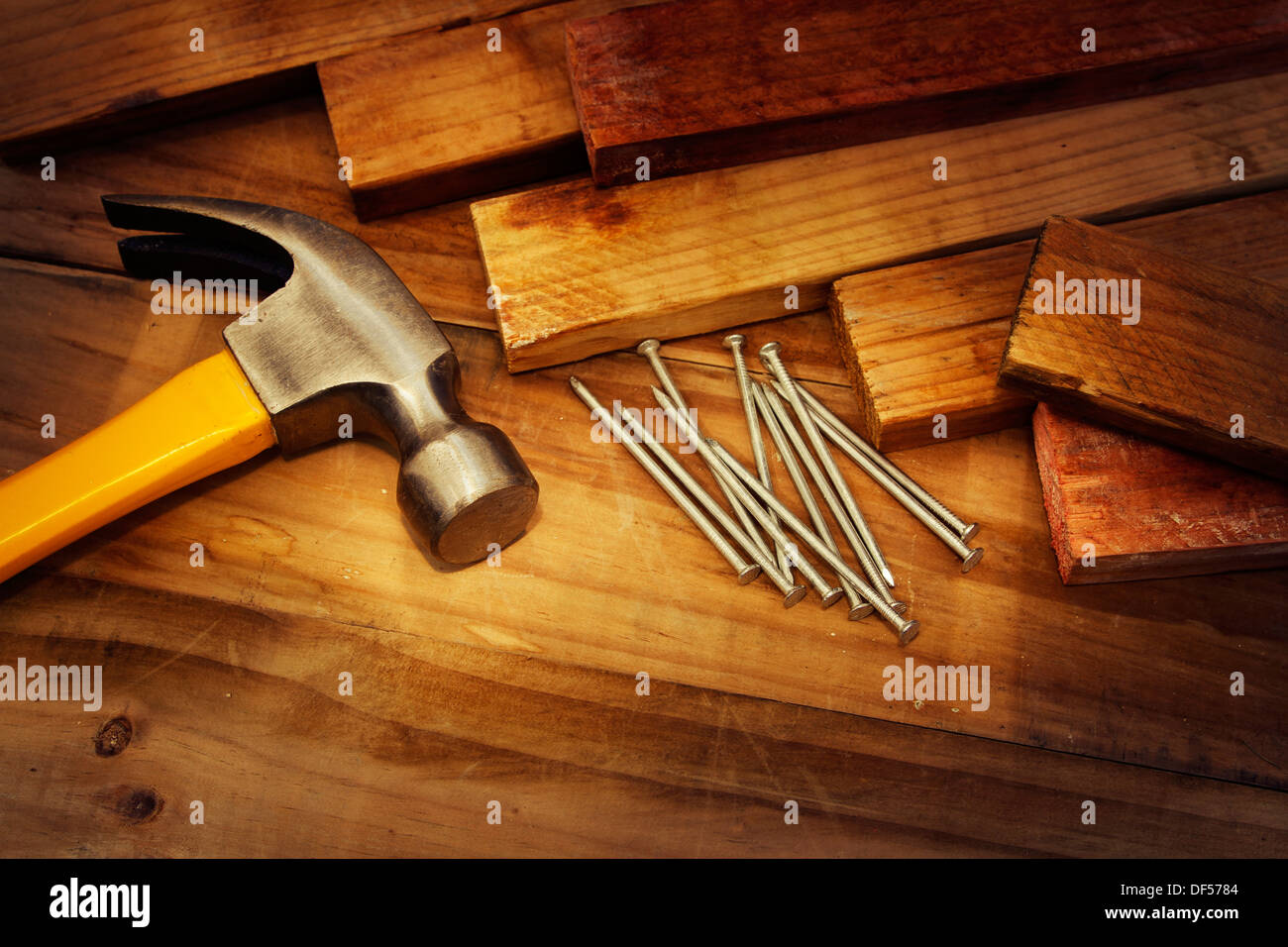 Hammer and nails on wood Stock Photo - Alamy